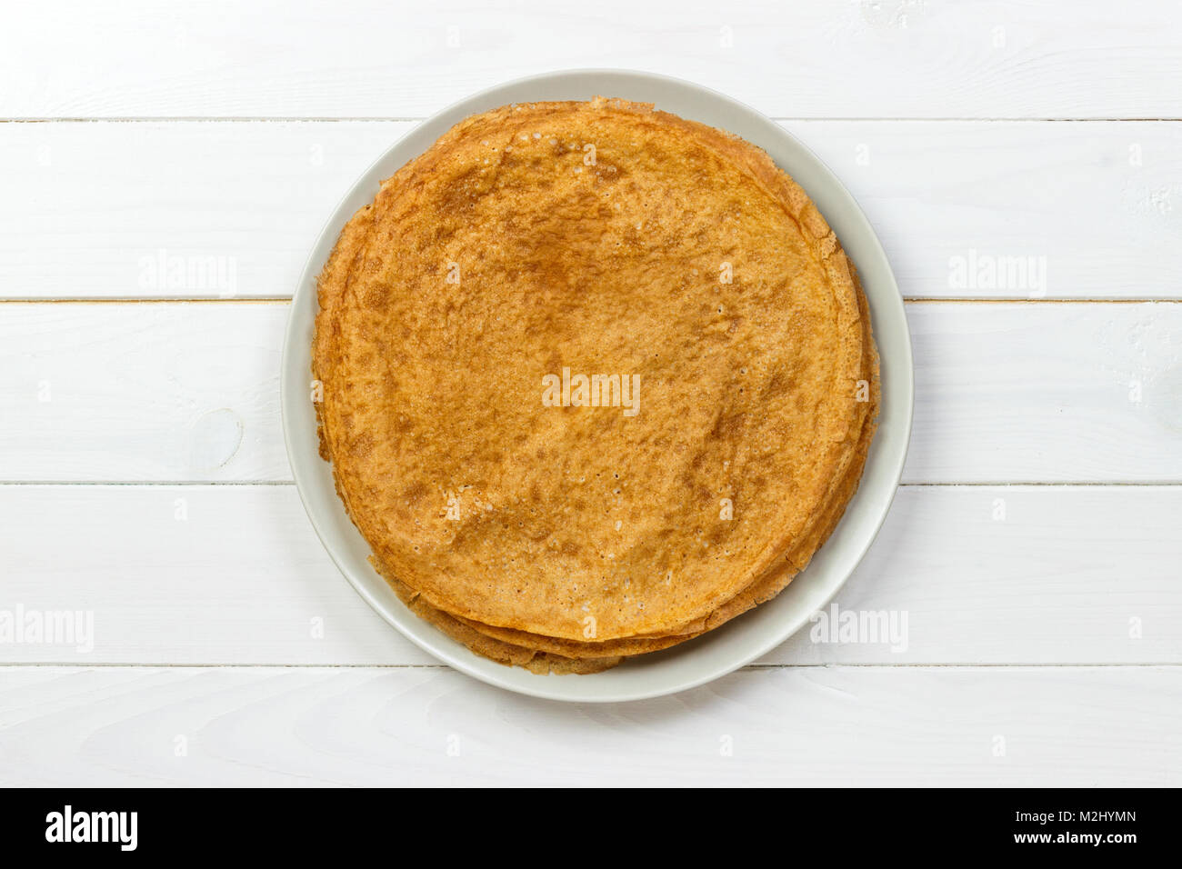 Stack of pancakes on white wooden table, top view Stock Photo - Alamy