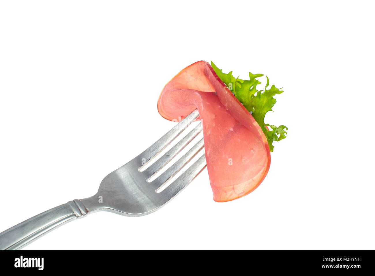 Slice of smoked ham on fork Stock Photo - Alamy