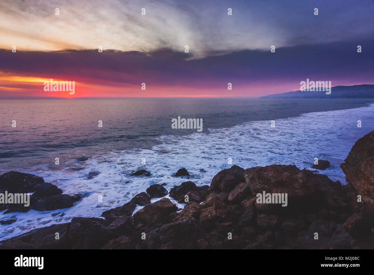 Amazing sunset along Point Dume State Beach with colorful sky, waves ...