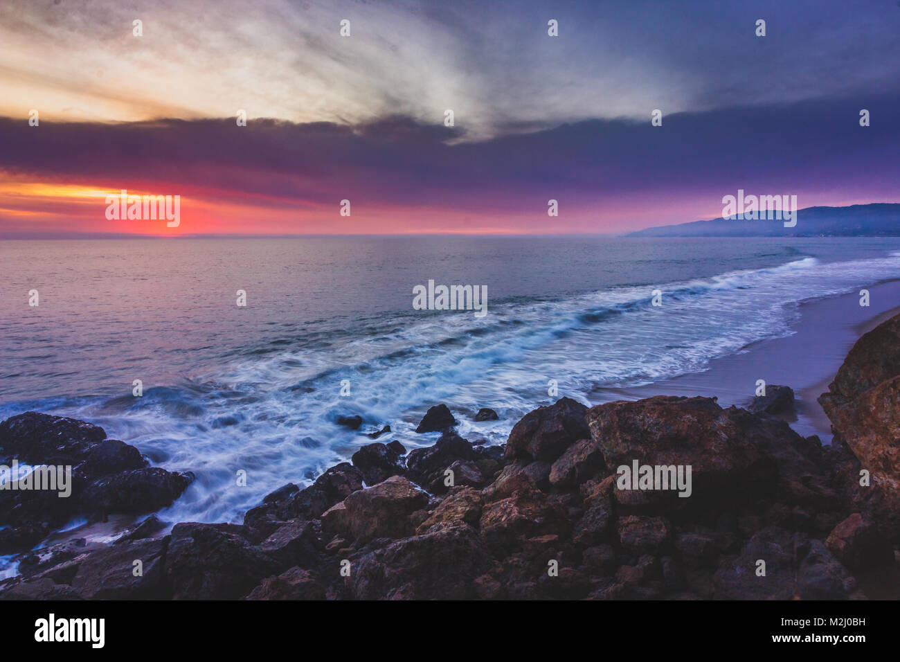 Amazing sunset along Point Dume State Beach with colorful sky, waves ...