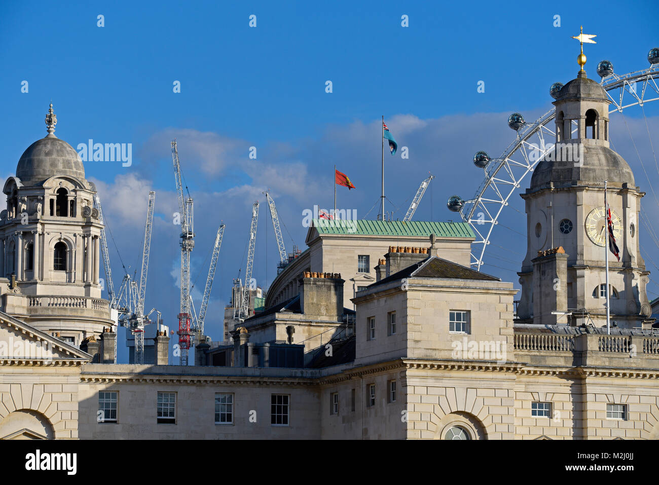 Horse Guards building with The OWO construction cranes and London Eye ...