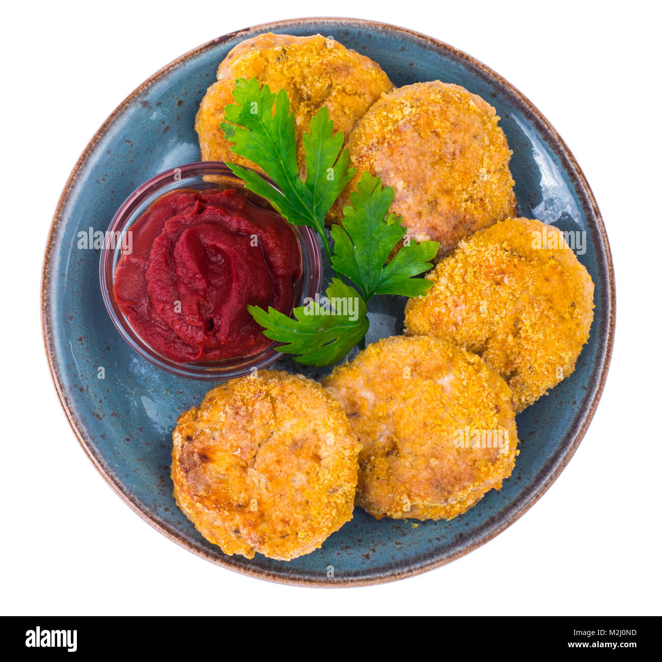 Fish cutlets on blue plate Stock Photo - Alamy