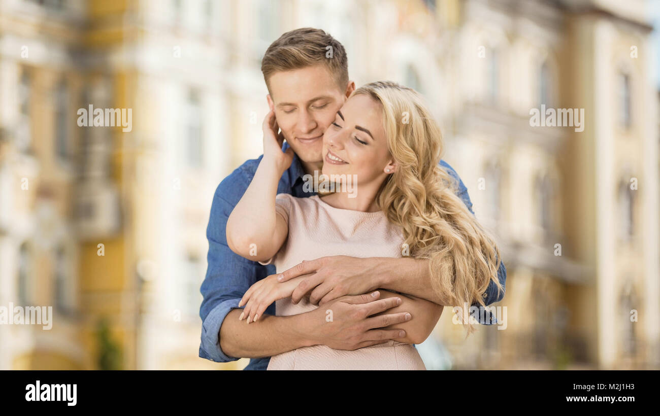 Guy hugging girlfriend from behind hi-res stock photography and images ...