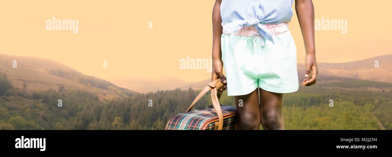 Travelling girl with bag in front of landscape Stock Photo - Alamy