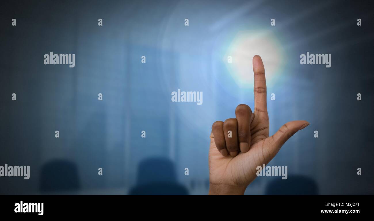 Hand touching light in dark office Stock Photo - Alamy