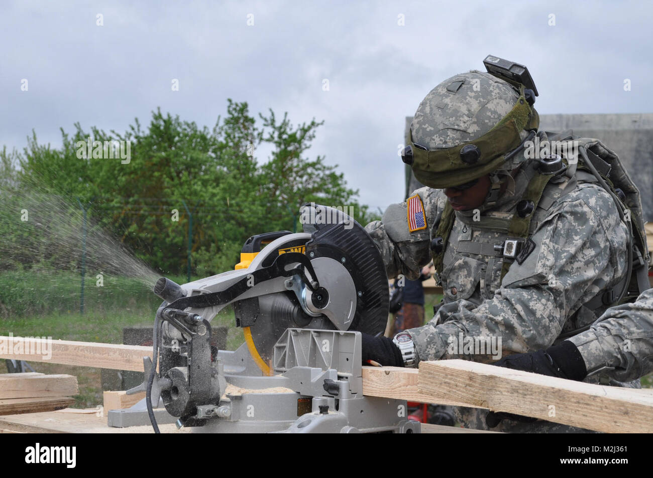 Soldier Cuts Wood By Eucom Stock Photo Alamy