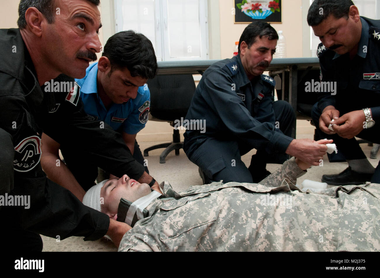 Iraqi policemen from Haditha treat the notional wounds of a military ...
