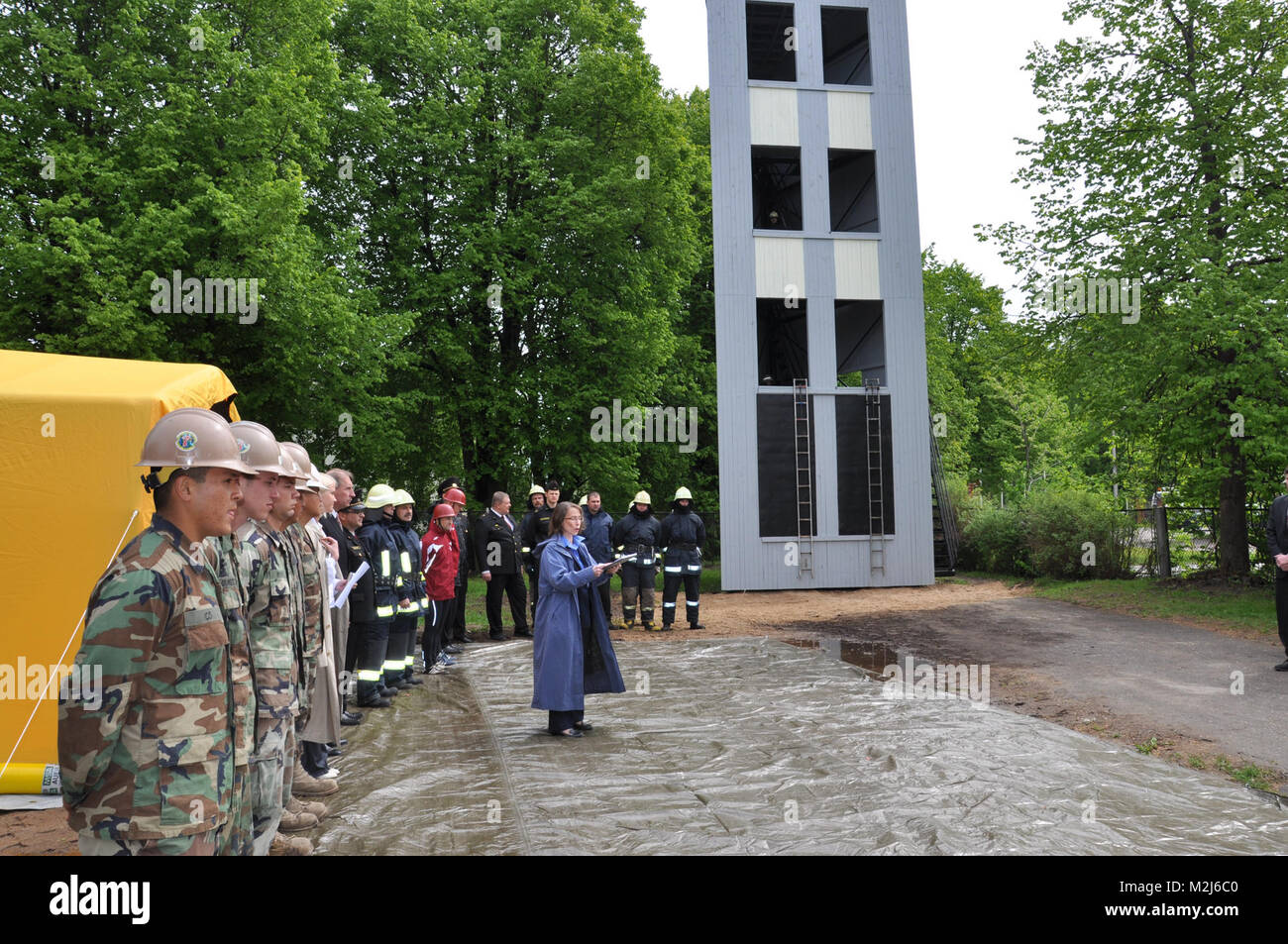 U.S. Ambassador helps dedicate renovated Latvian fire fighting tower by ...
