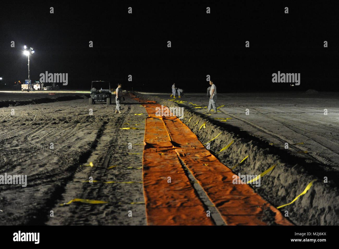 GRAND ISLE, La. - Soldiers with the Louisiana Army National Guard work ...