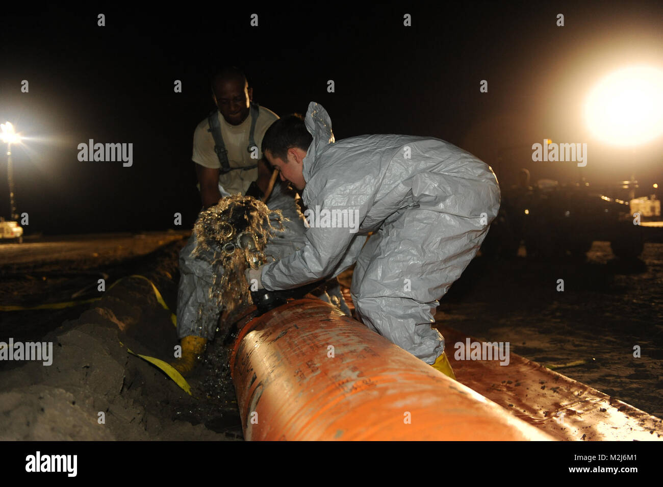 GRAND ISLE, La. - Soldiers with the Louisiana Army National Guard work ...