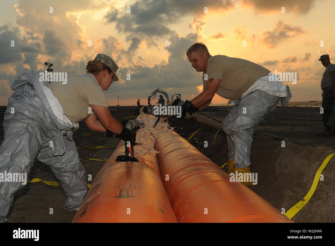 GRAND ISLE, La. - Soldiers with the Louisiana Army National Guard work ...