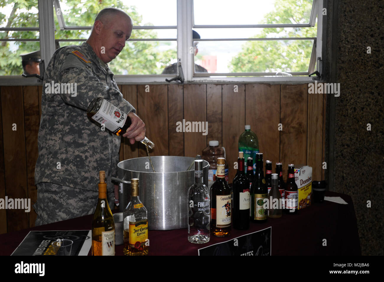 Col. Dort Payne adds his ingredient to the grog during the 235th Army ...