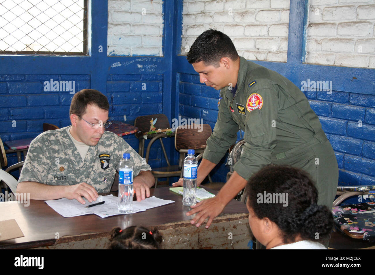 Army Reserve surgeon, Maj. Daniel Perri from Sunbury, Pa., works with ...