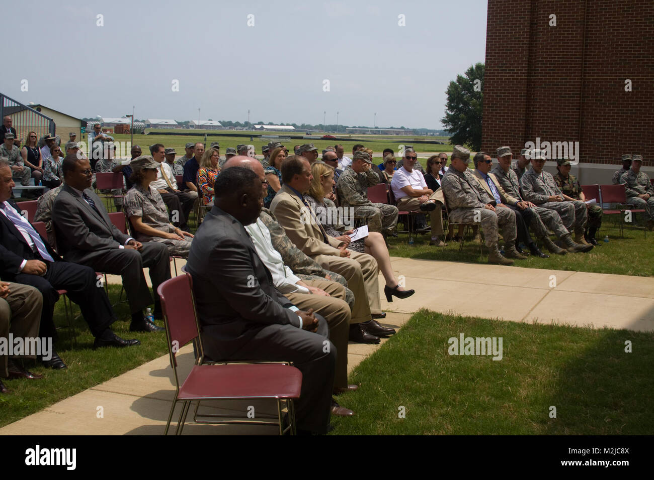 Employees and guests look on as the 497th Intelligence, Surveillance ...