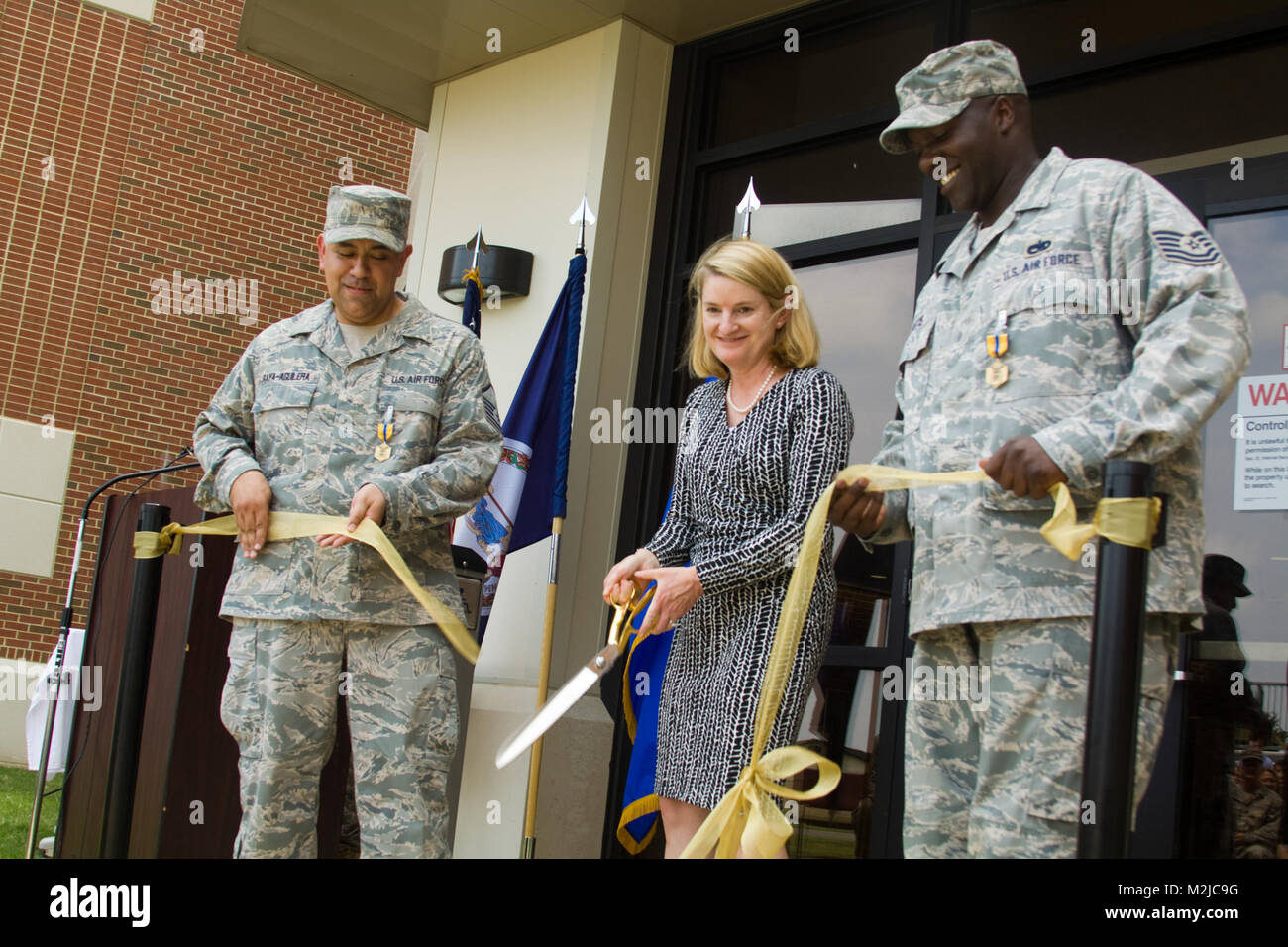 Master Sgt. Joaquin Raya (left) and Tech Sgt. Gregory Artis flank ...
