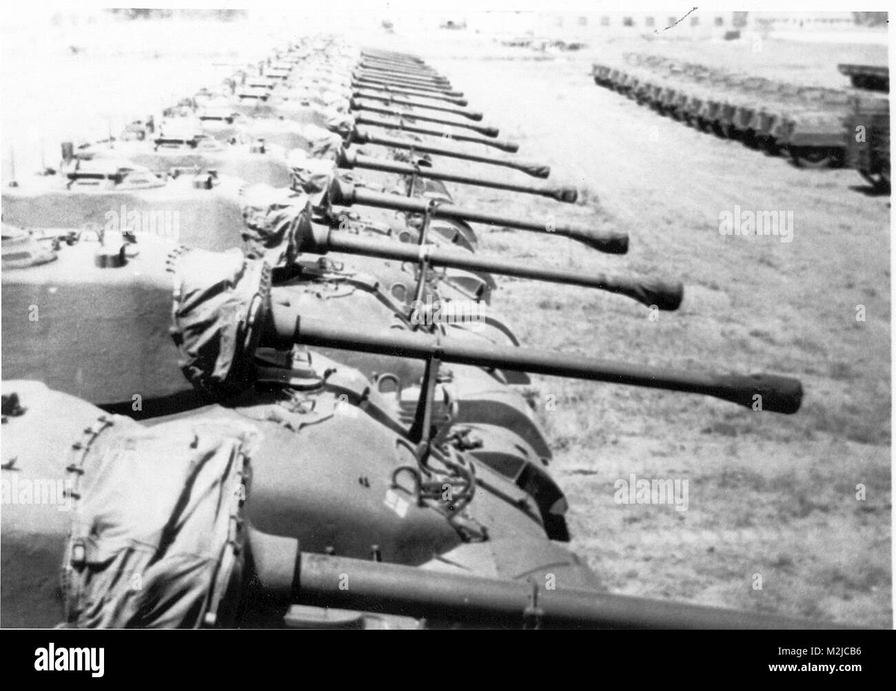 A row of M4 Sherman tanks sits at Camp Guernsey. Tanks like these would ...