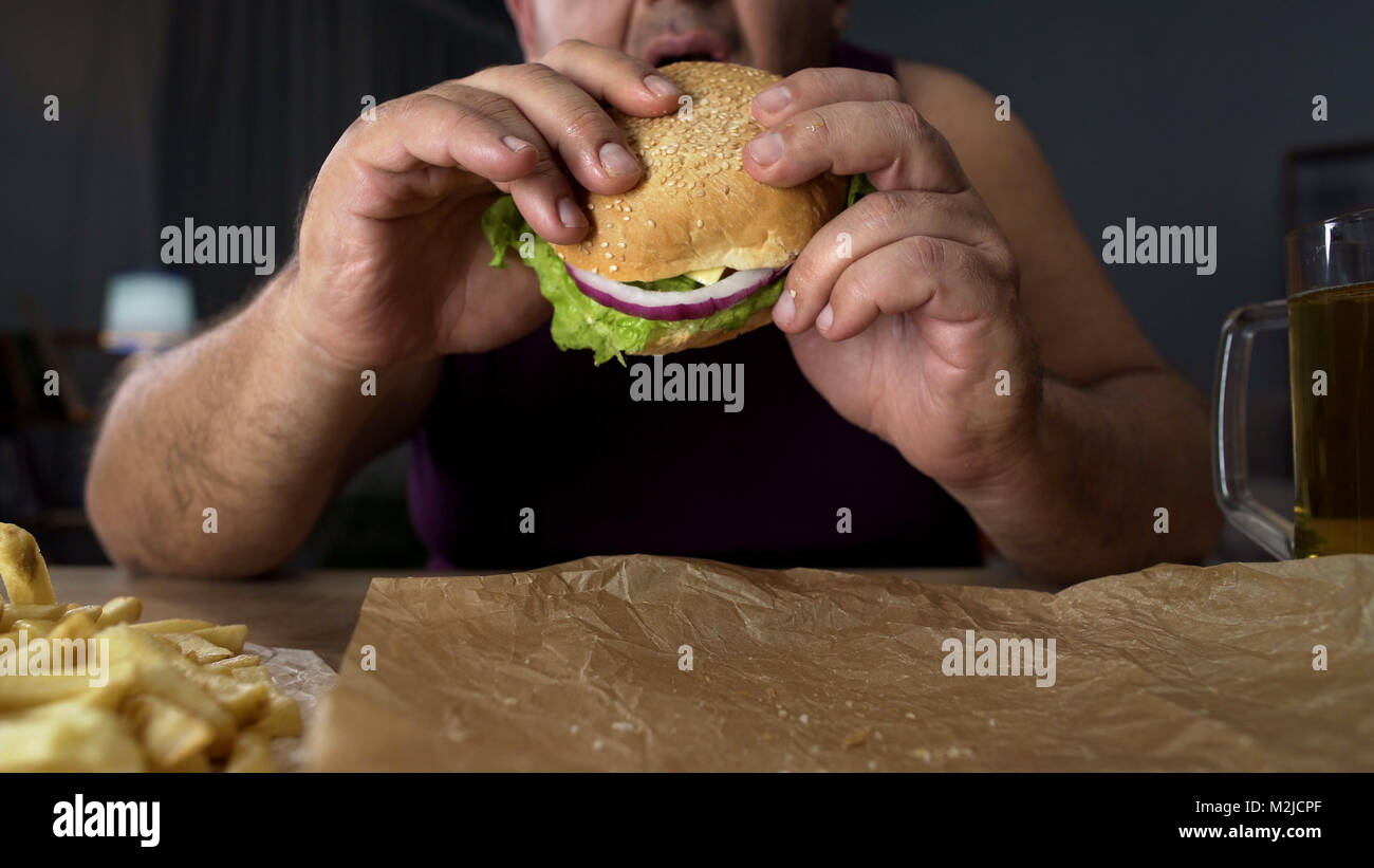 Obese person biting big burger, addicted to unhealthy junk food ...