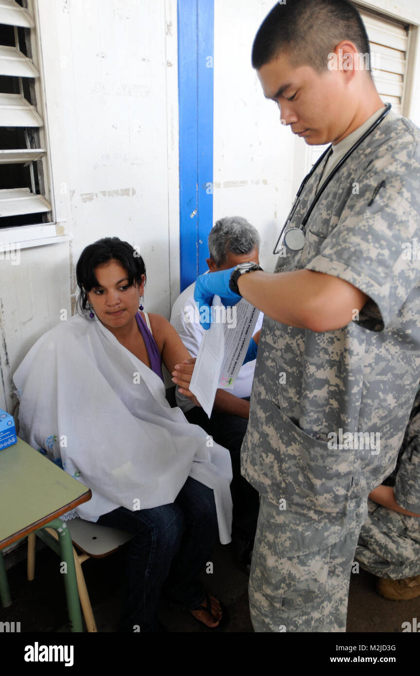 Spc. Charles Yeh from Temple City, Calif. monitors the vitals of a ...
