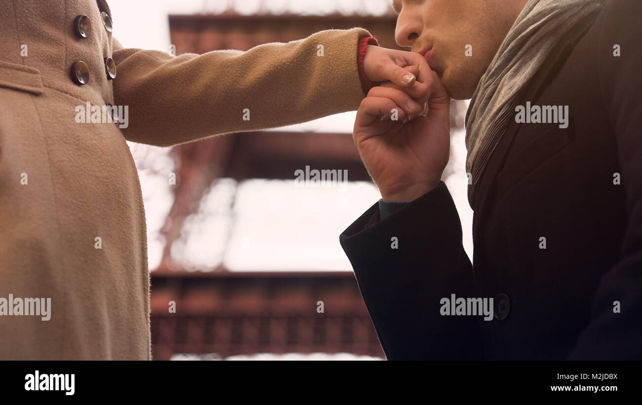 Man confessing his feelings and kissing hand to his girlfriend ...