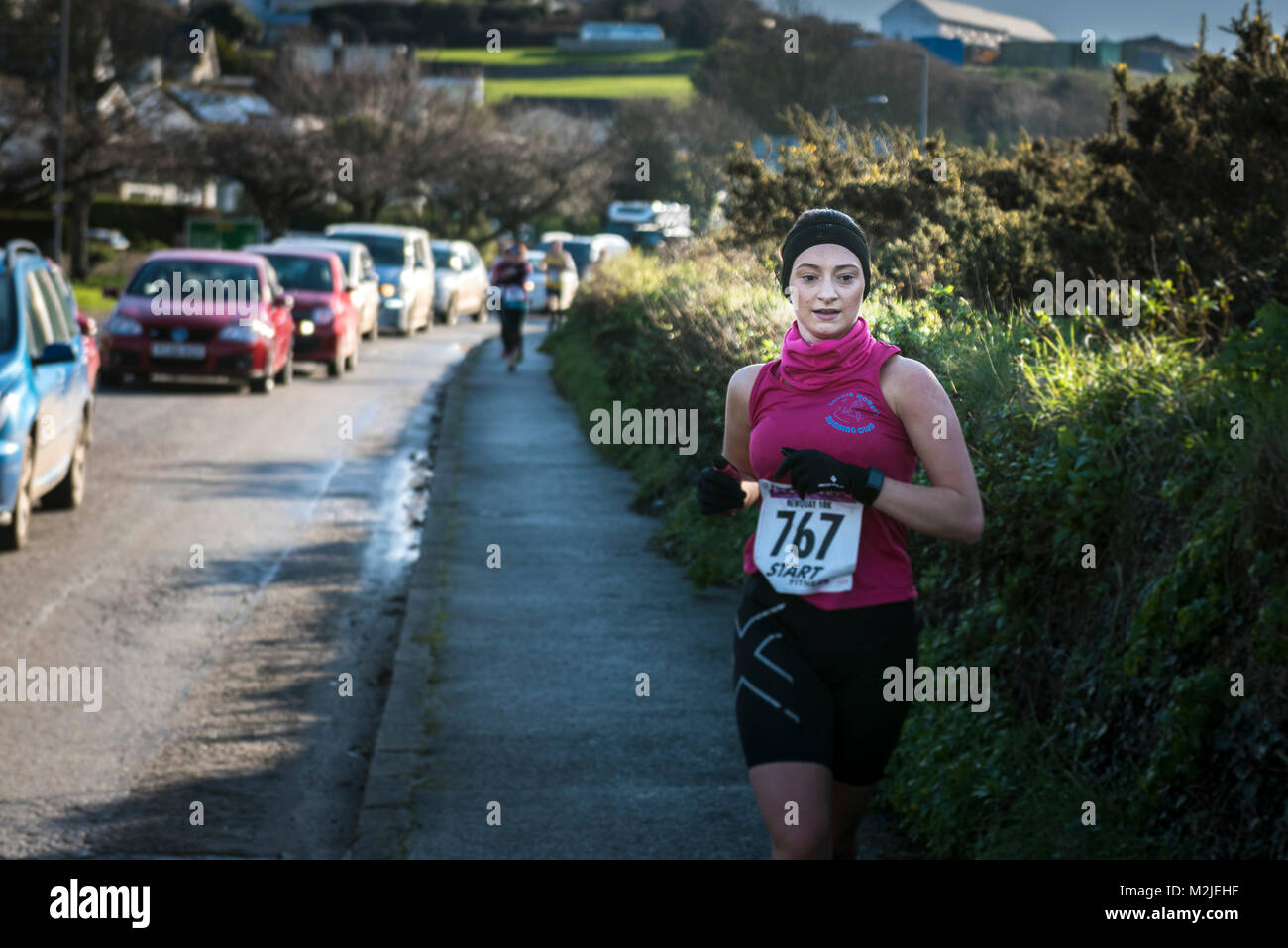 Runners competing in a road race in Newquay Cornwall Stock Photo - Alamy