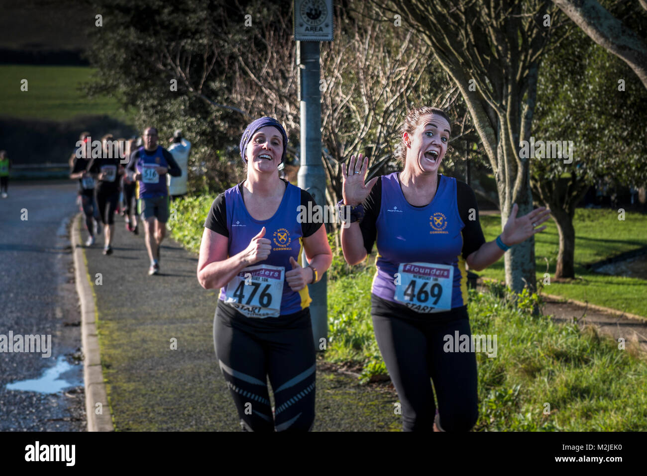 Runners competing in a road race in Newquay Cornwall Stock Photo - Alamy