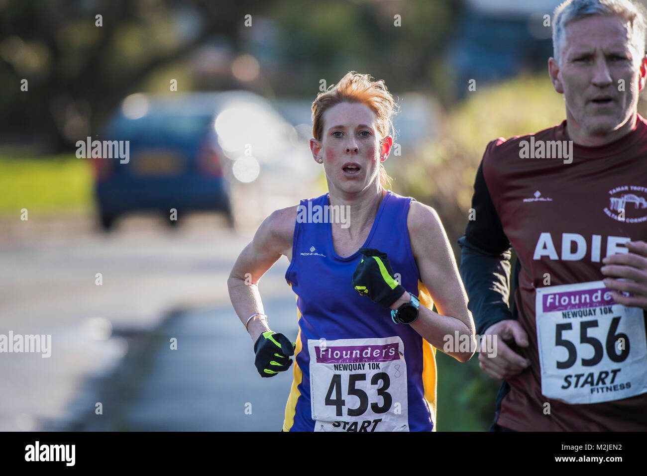 Runners competing in a road race in Newquay Cornwall Stock Photo - Alamy