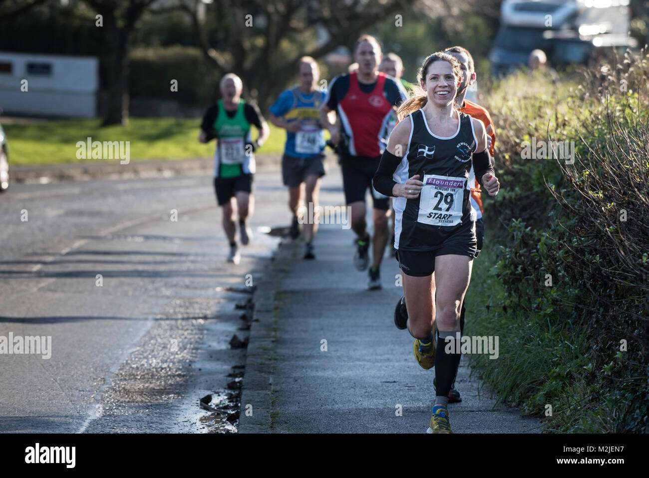 Runners competing in a road race in Newquay Cornwall Stock Photo - Alamy