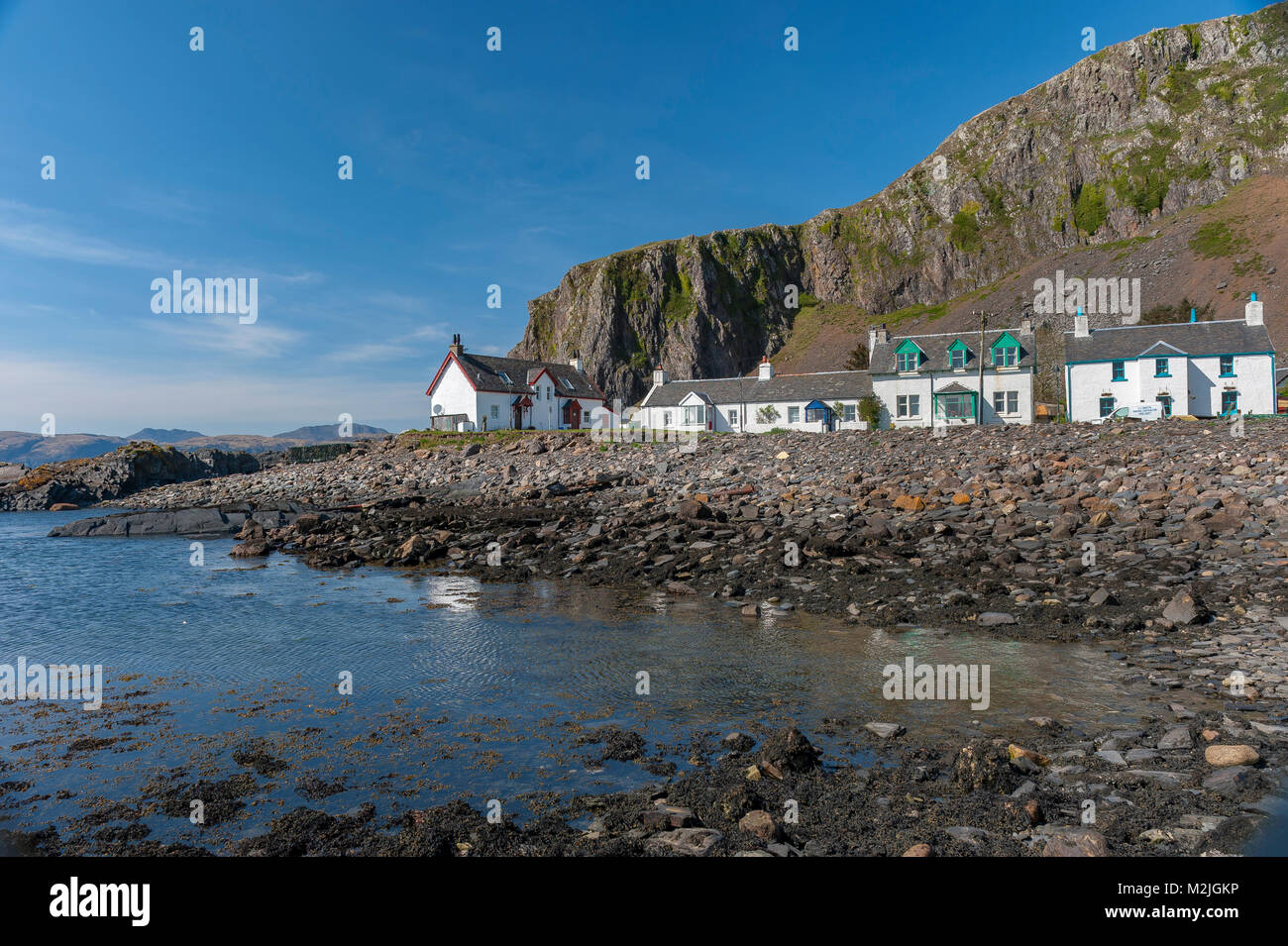 Stunning view of village of Ellenabeich Seil Island, Scotland, with ...
