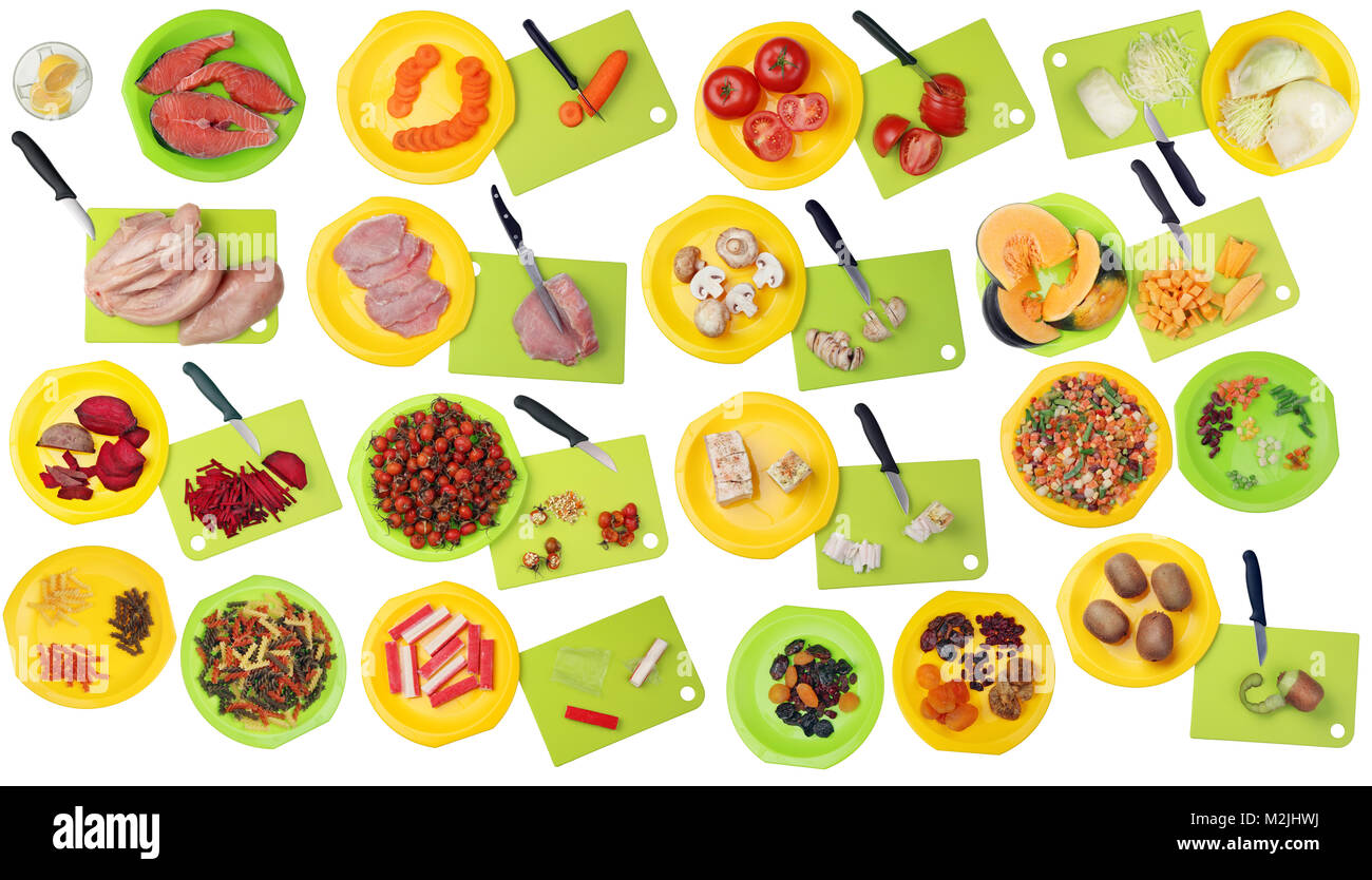 Stages of cooking in the kitchen. Vegetables and meat are cut on ...