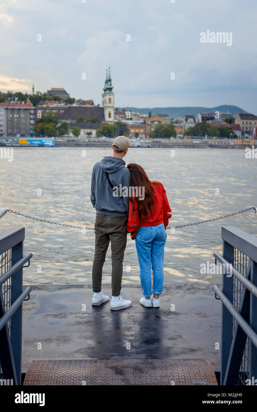 Romantic outdoor back portrait. Couple in love is enjoying the ...