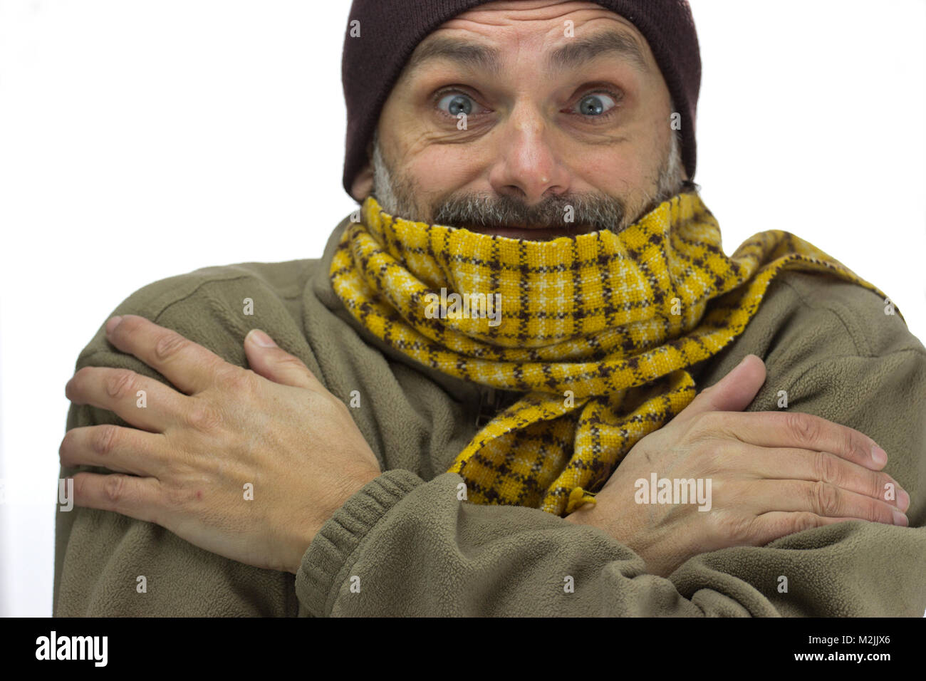 smiling mature man freezing over white background Stock Photo - Alamy