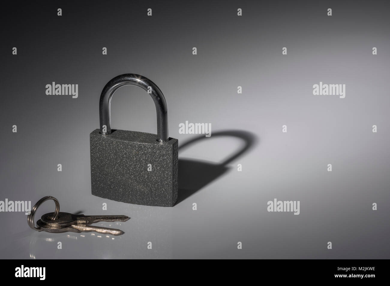 Small padlock on plain background. For concept of data security, email ...
