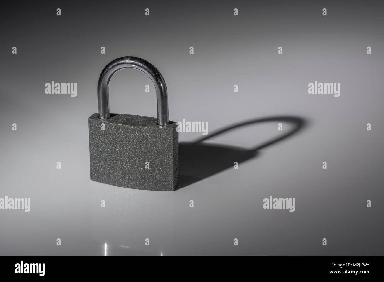Small padlock on plain background. For concept of data security, email ...