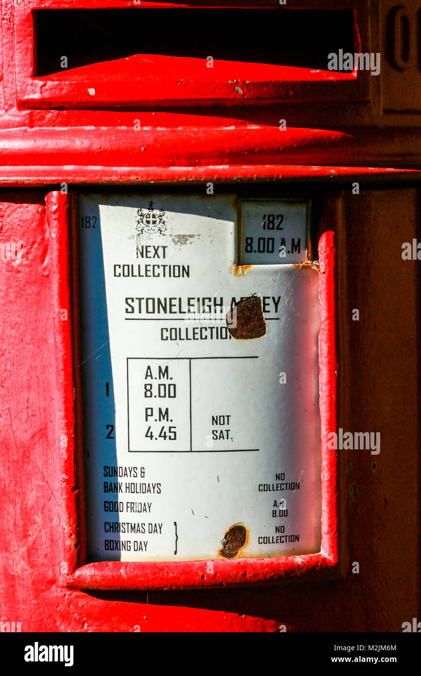 A red pillar,or post, box marked with the crest of Queen Victoria Stock ...