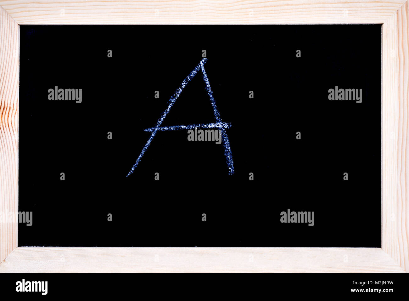 Blackboard with white chalk writing showing grade A Stock Photo - Alamy