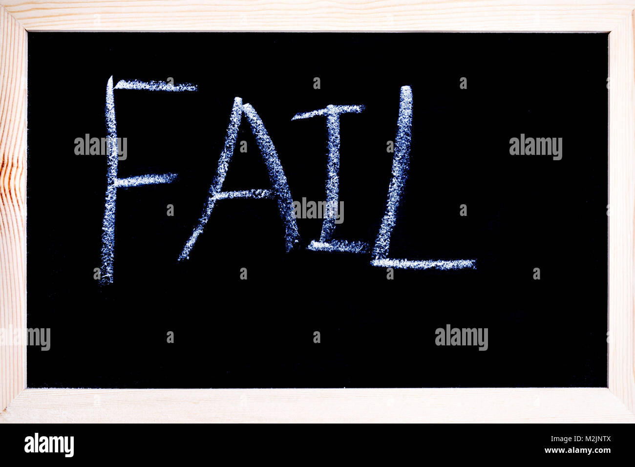 Blackboard with white chalk writing showing the word Fail Stock Photo ...