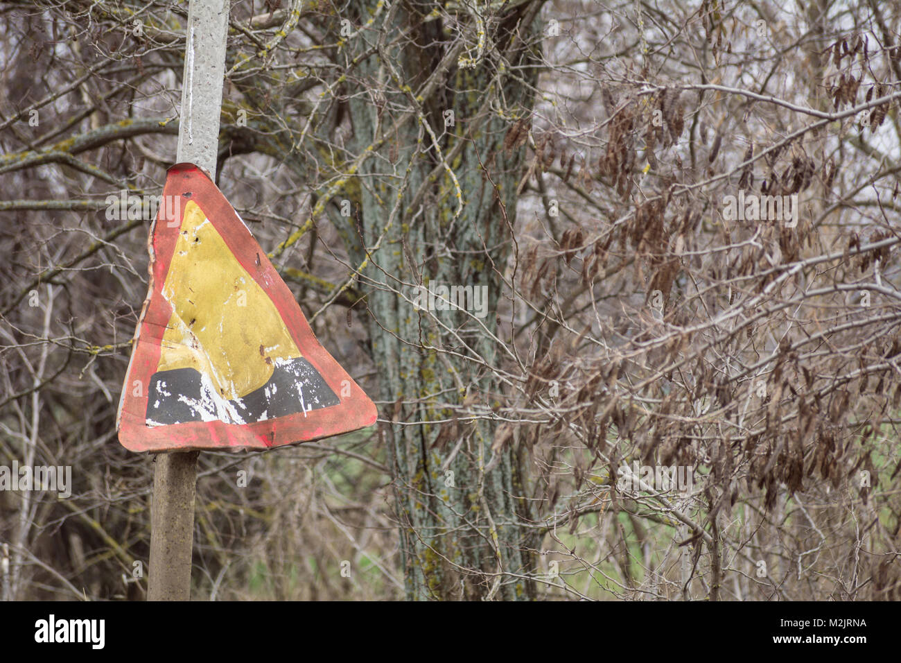Old scratched road sign - Caution pits Stock Photo - Alamy