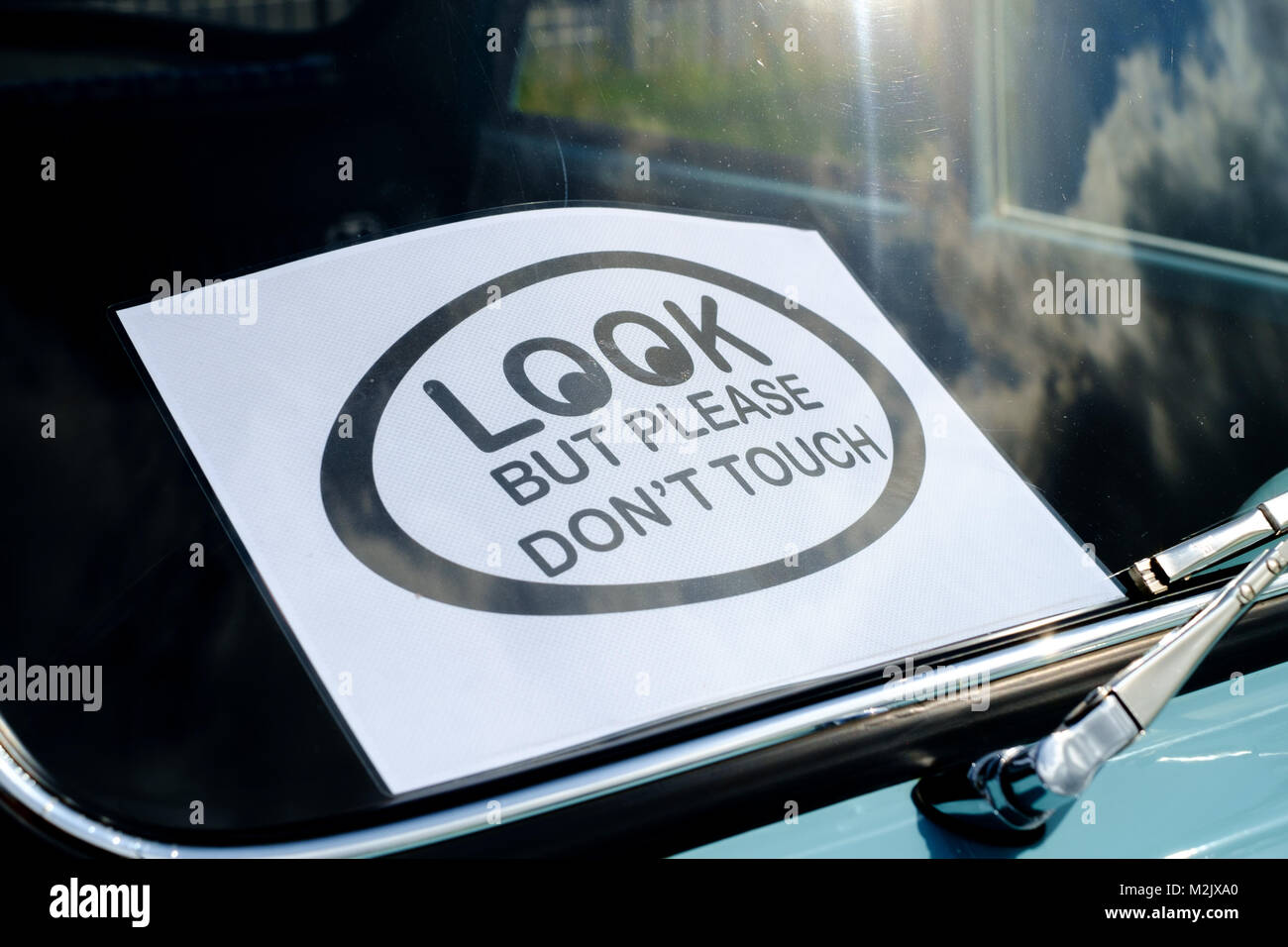 'Look but please don't touch' sign on dashboard of Morris Minor classic ...