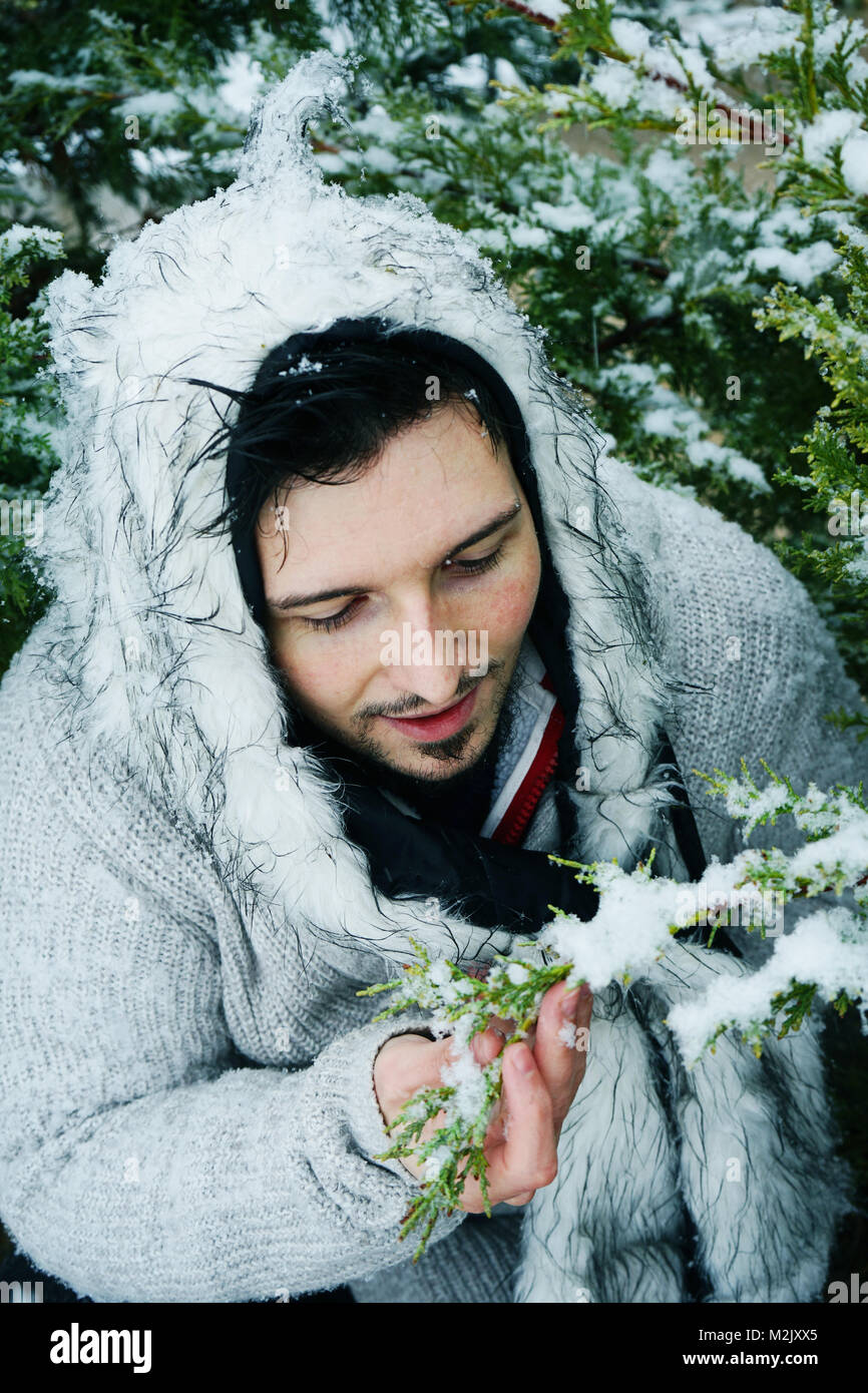Young man enjoying a winter and snowy day Stock Photo - Alamy