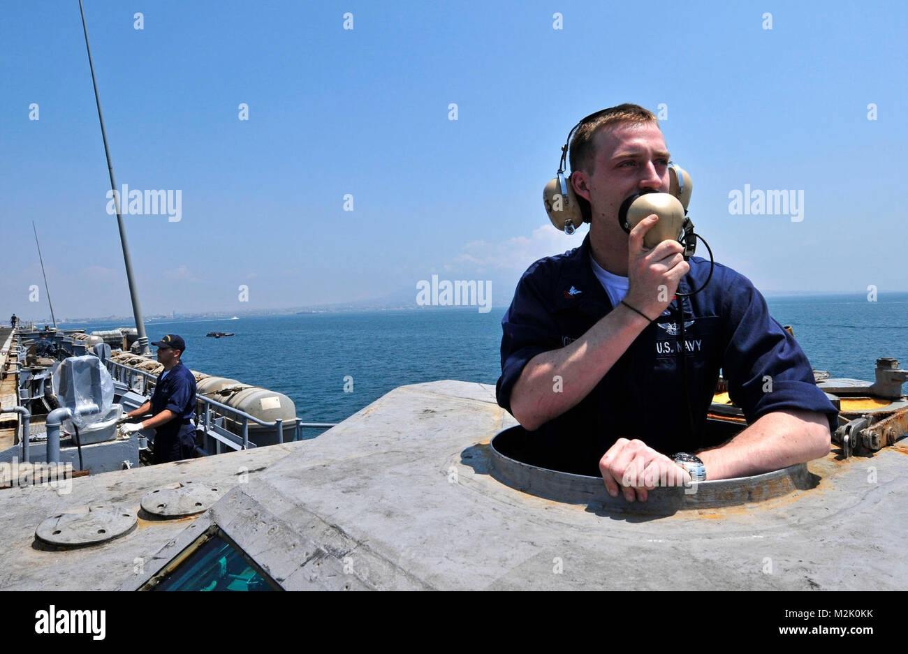 Aviation boatswain's mate helps conducts aircraft carrier maintenance ...