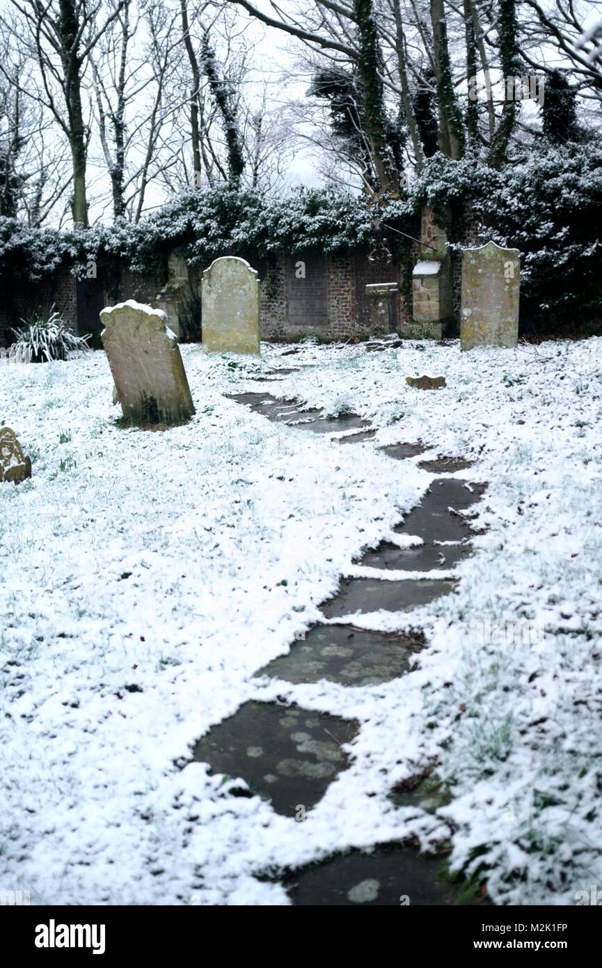 Folkington churchyard in snow Stock Photo - Alamy