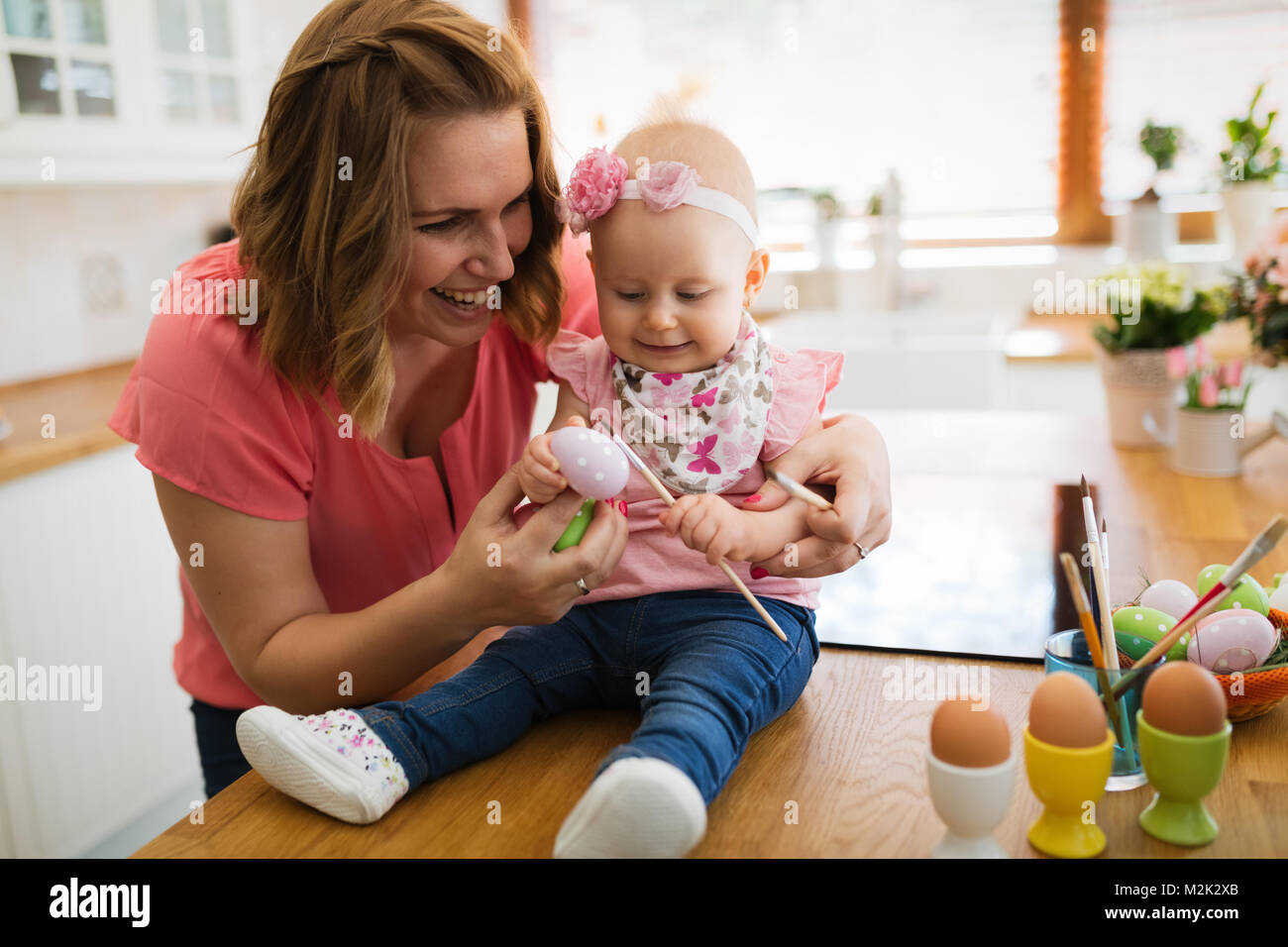 Happy family in easter time Stock Photo - Alamy