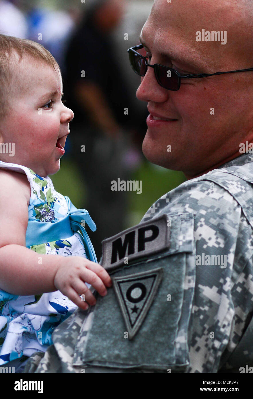 Staff Sgt. Chris Pearce holds his 5-month-old daughter Bella Pearce ...