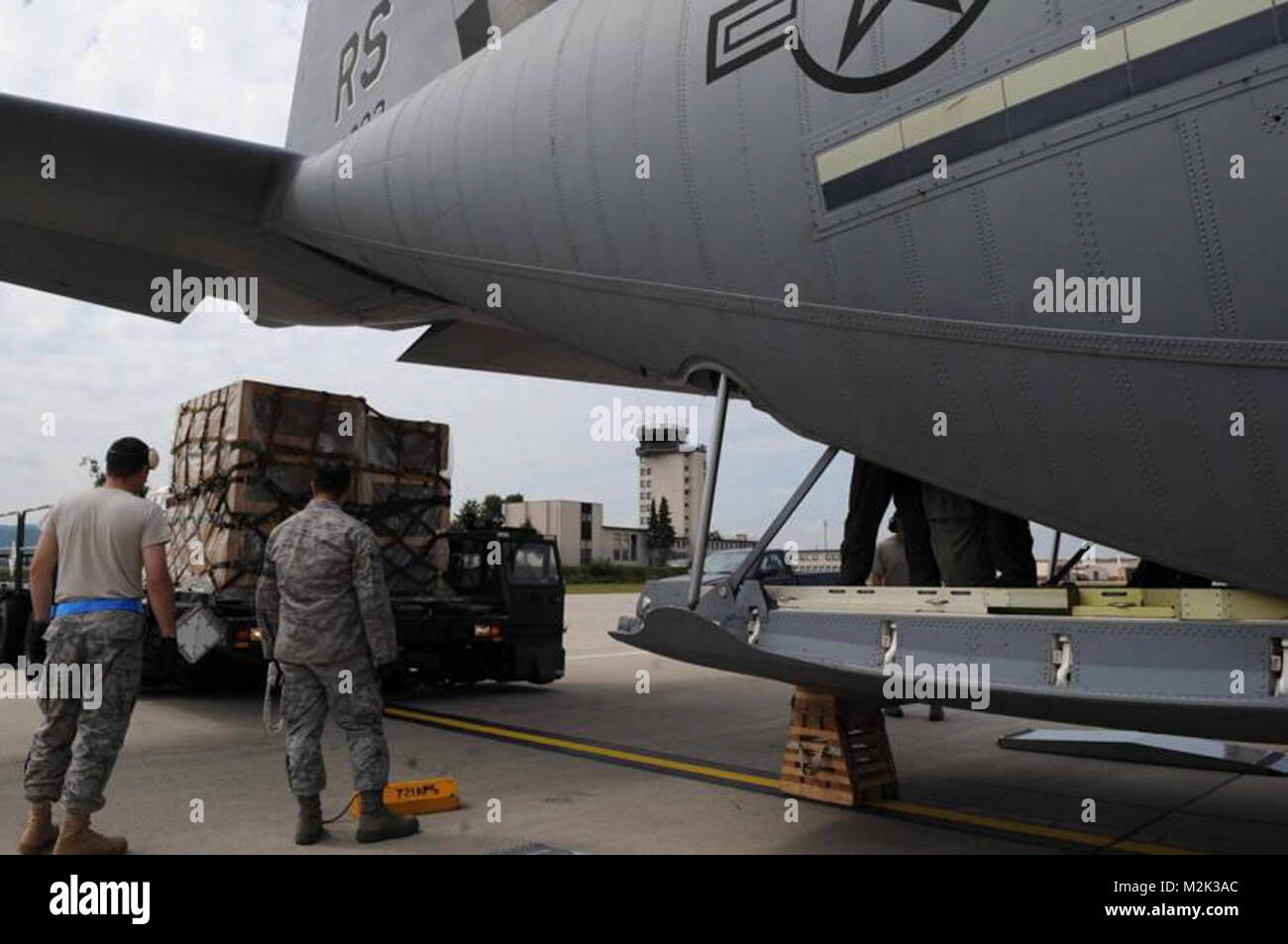 Airmen load firefighting equipment into plane by EUCOM Stock Photo - Alamy