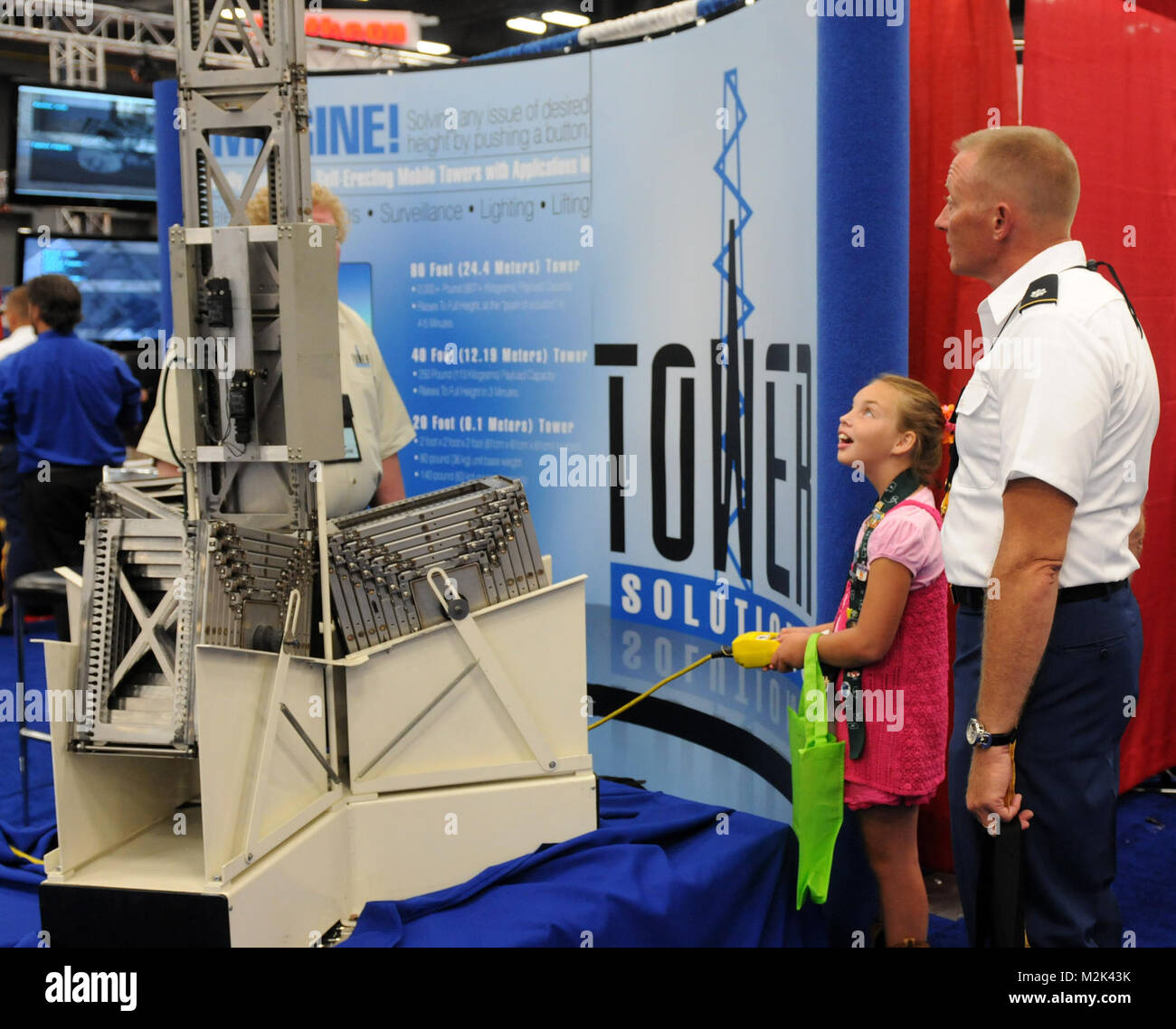 Nina Zielke, of Kansas, checks out a self-constructing tower with her ...