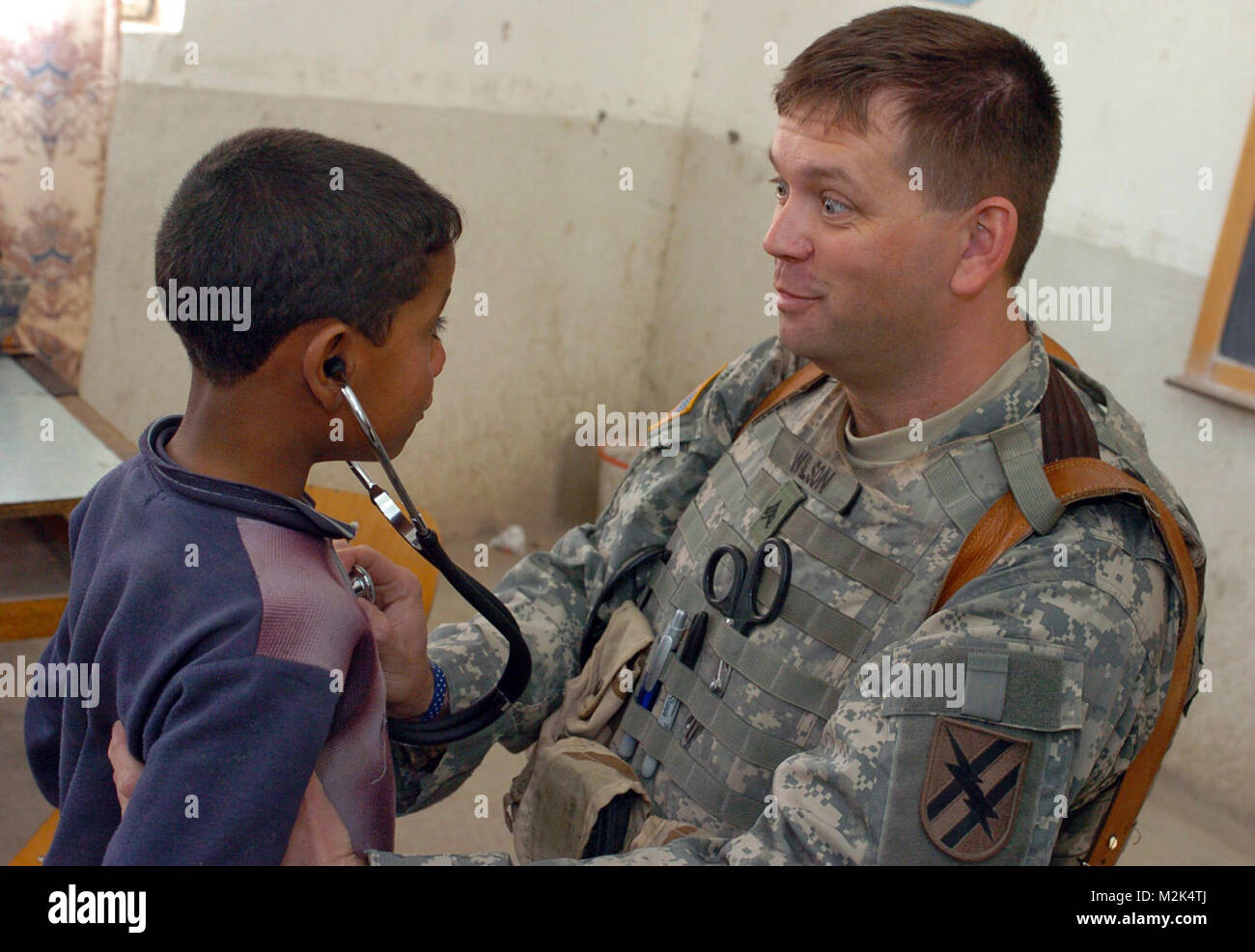 Sgt. Carlton Wilson(r) a medic for Company C, 148th SB makes a funny ...