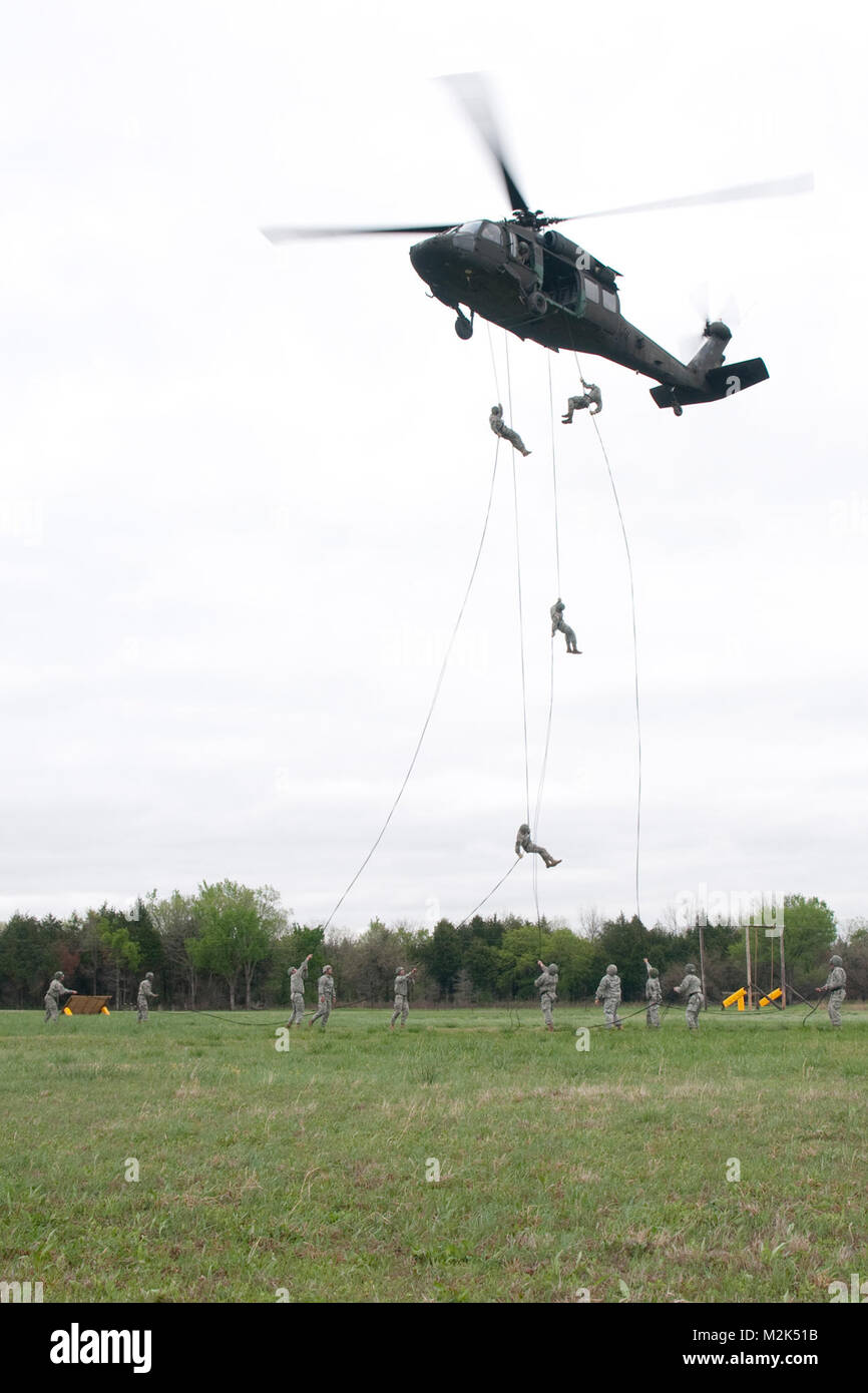 Soldiers and Airment rappel from a UH-60 Black Hawk helicopter during ...