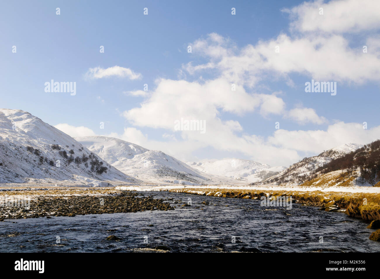 The River Findhorn winding through the Findhorn valley below the snow ...
