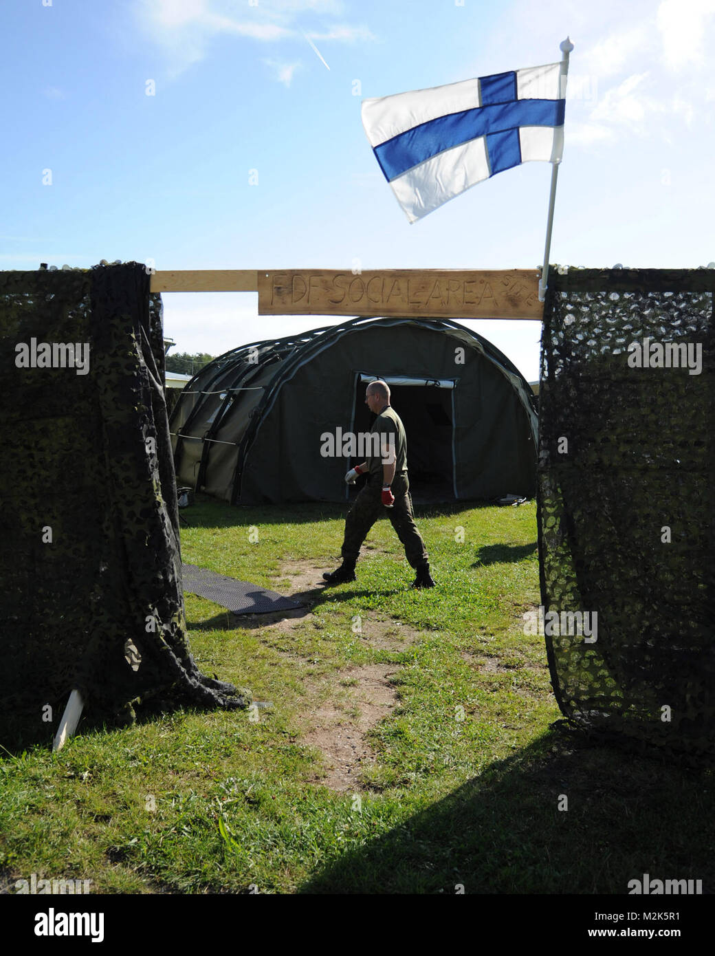 A member of the Finnish Defense Force sets up the FDF recreational area ...