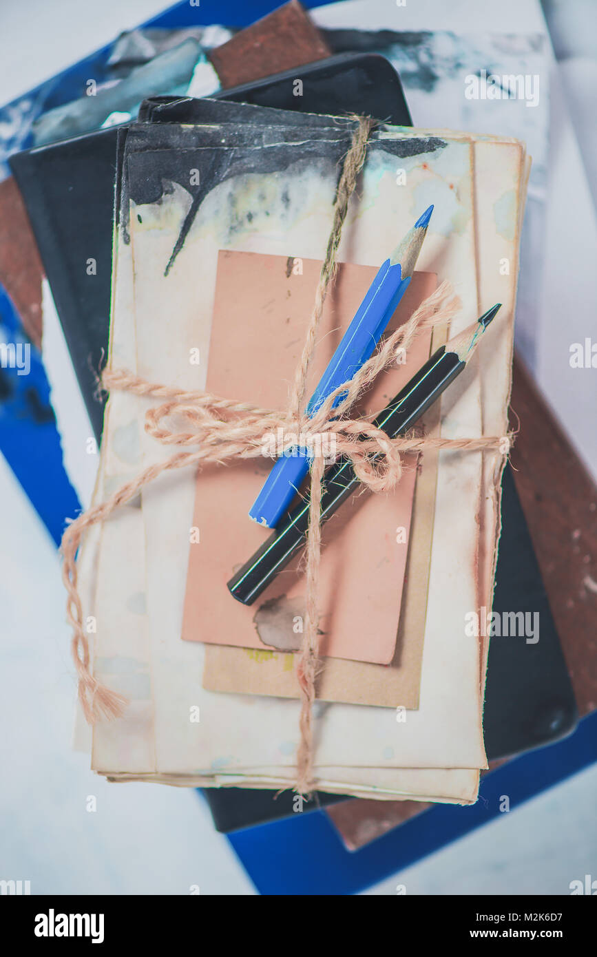 Stack of drafts, pencil boxes and papers with two pencils. Editor or ...